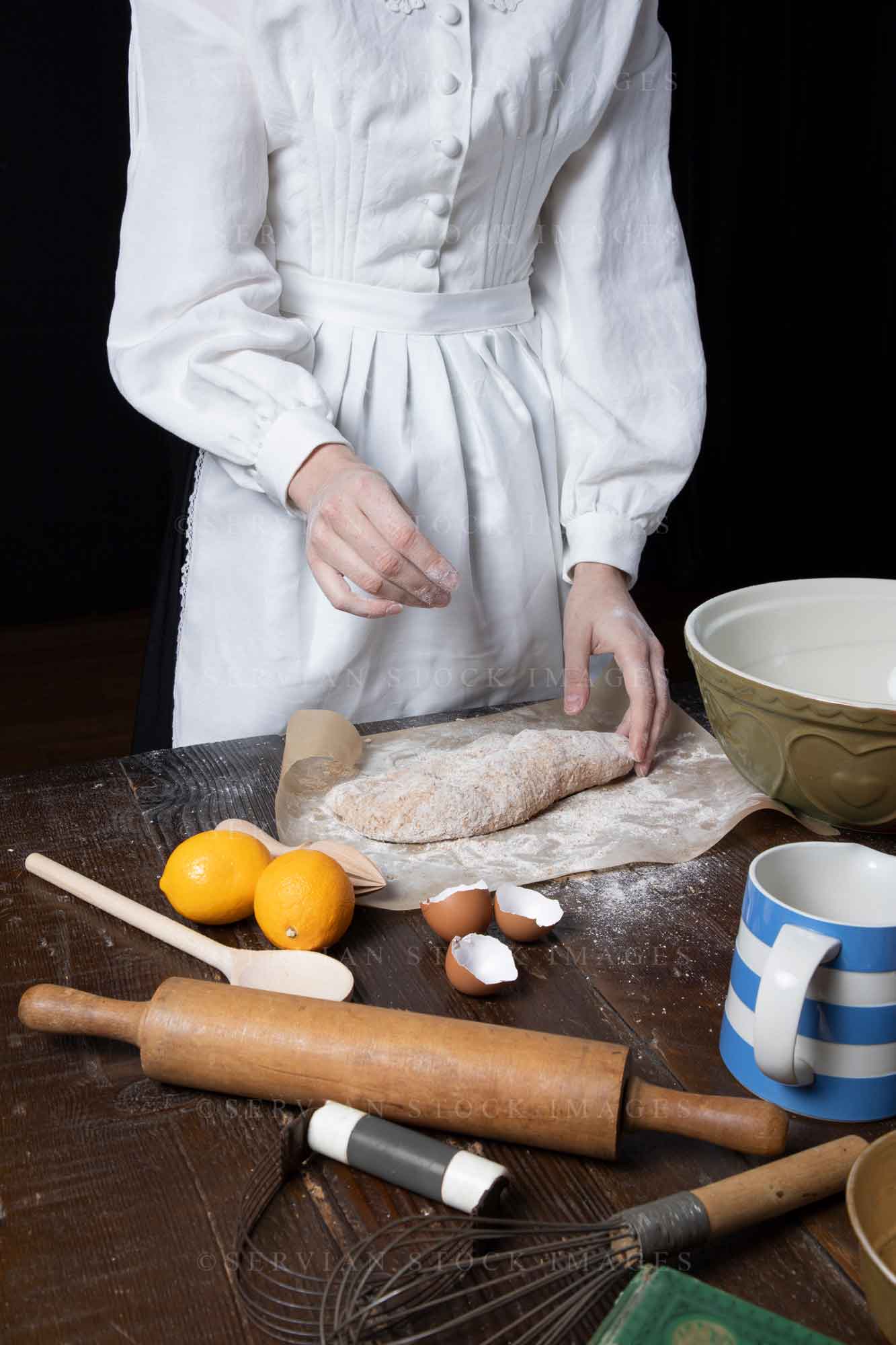 Victorian woman baking in her kitchen (Lauren 2746) – Servian Stock Images